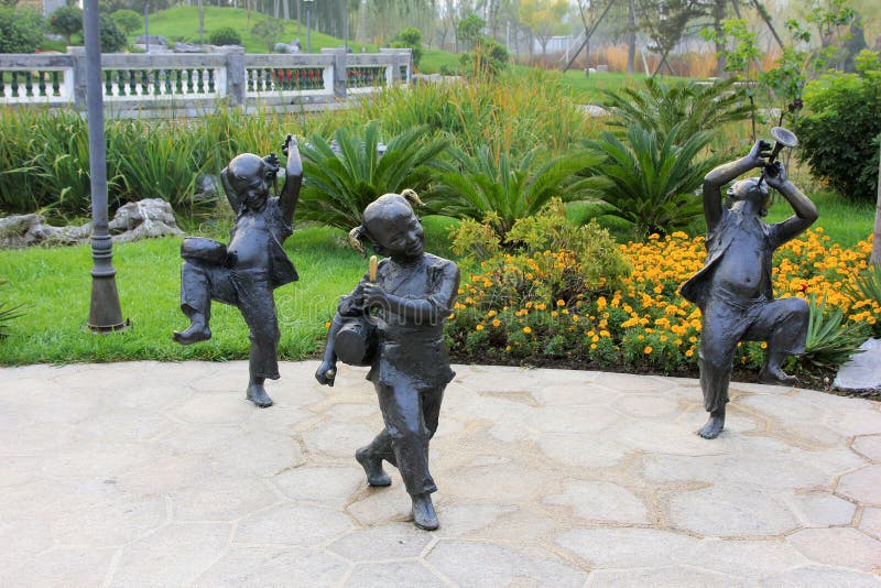 Children statue in a park editorial photo. Image of ground - 216217131