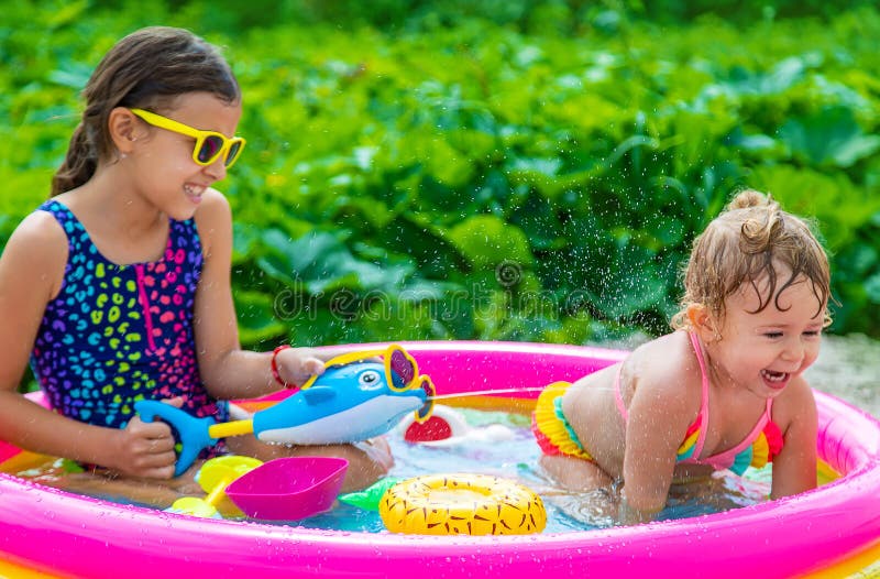 Children Swim in the Pool. Selective Focus Stock Image - Image of ...