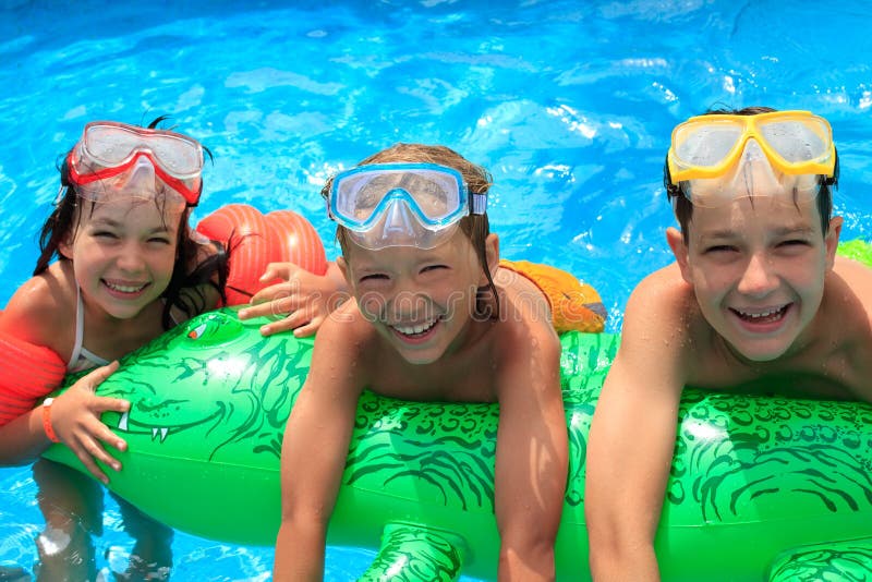 Children in swimming pool stock image. Image of males - 12112125