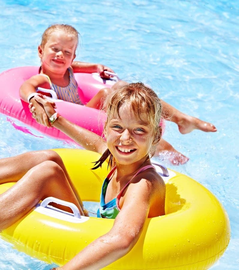 Happy Girl and Boy Swim at the Childrens Inflatable Toy Stock Image ...