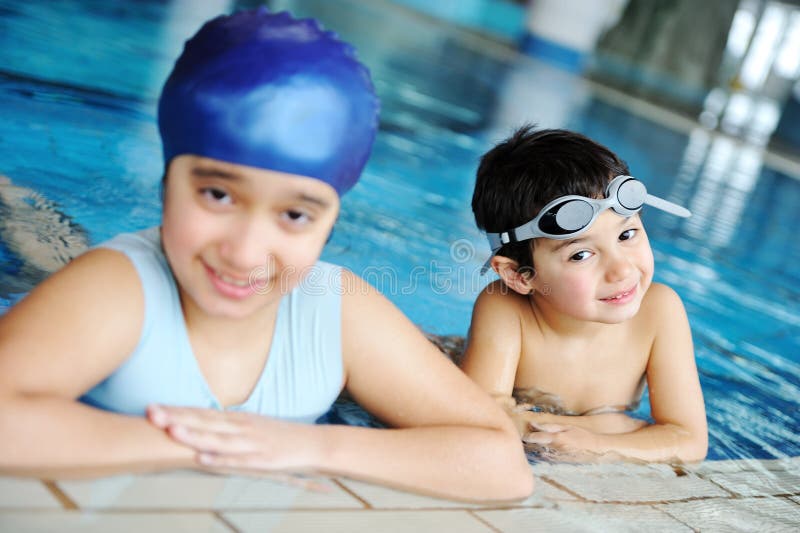 Children in Swimming Pool Learning Swimming. Stock Photo - Image of ...