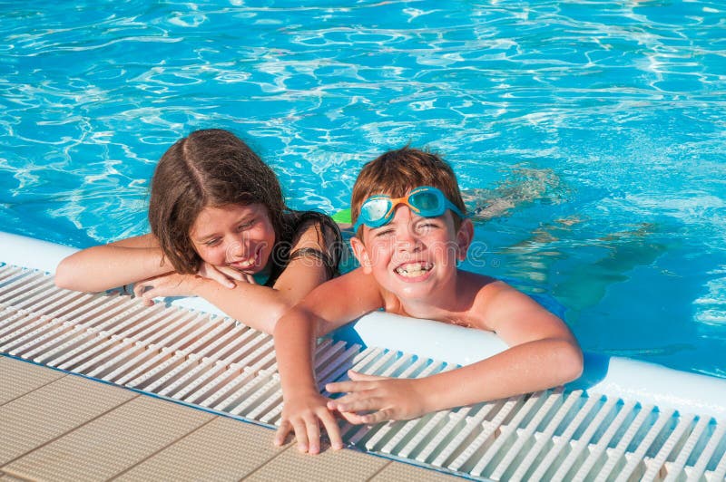 Children at swimming pool stock photo. Image of children - 76733816