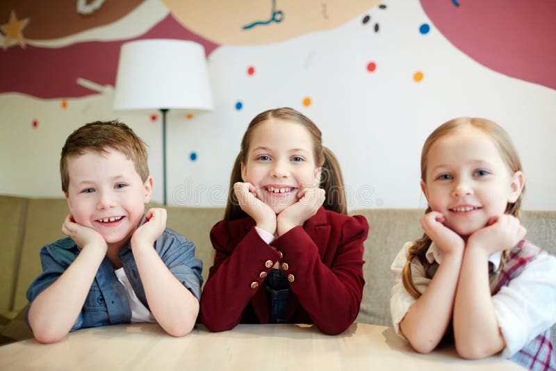 Children by table stock image. Image of friends, happy - 90734671