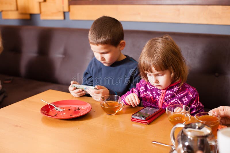 The children at the table stock image. Image of portrait - 111427009