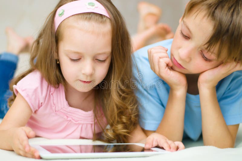 Children with Tablet Computer Stock Photo - Image of holding, brother ...
