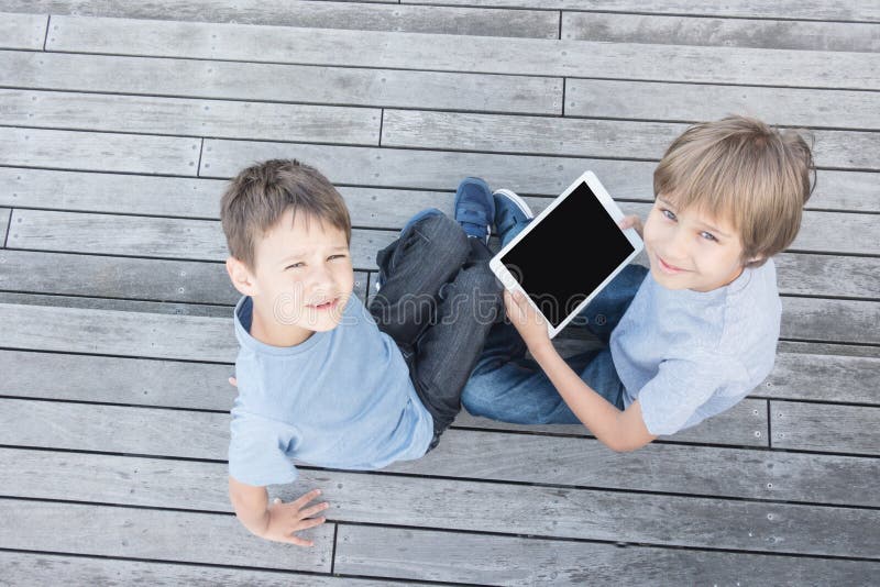 Children with Tablet Computers Outdoors. Top View Stock Photo - Image ...