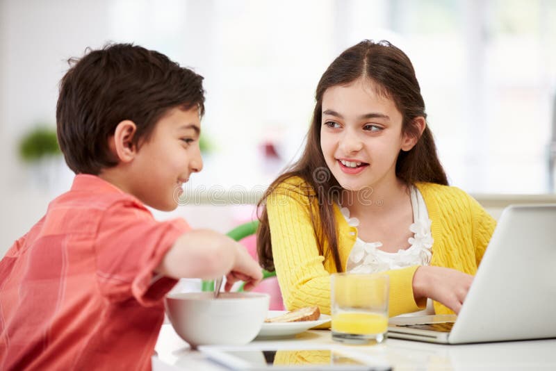 Children with Tablet and Laptop at Breakfast Stock Image - Image of ...