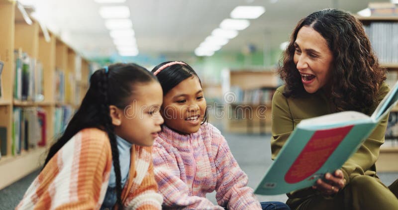 Children, Teacher and Education with Reading Book at Library for ...