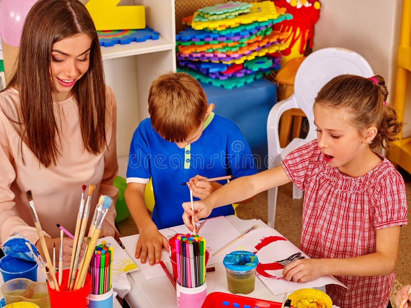 Teacher with Child in Preschool Stock Photo - Image of playroom, play ... Teacher with Child in Preschool Stock Photo - Image of playroom, play ...