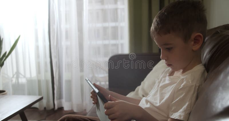 Children Tech Addiction Concept. Cute Preschool Kid Boy Using Digital ...