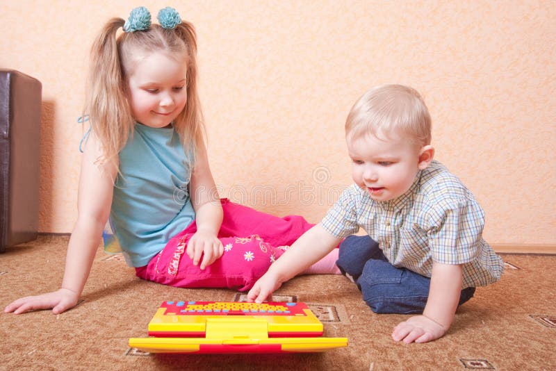 Children with toy stock image. Image of home, indoor - 19718643