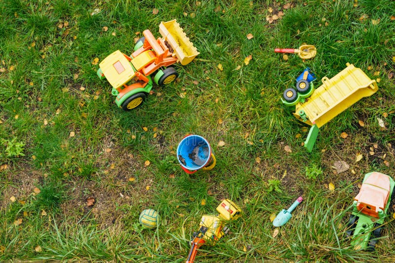 Children Toys Outdoors on Green Grass Stock Image - Image of ground ...