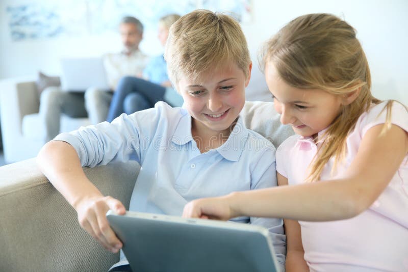 Children Using Digital Tablet at Home Stock Photo - Image of child ...