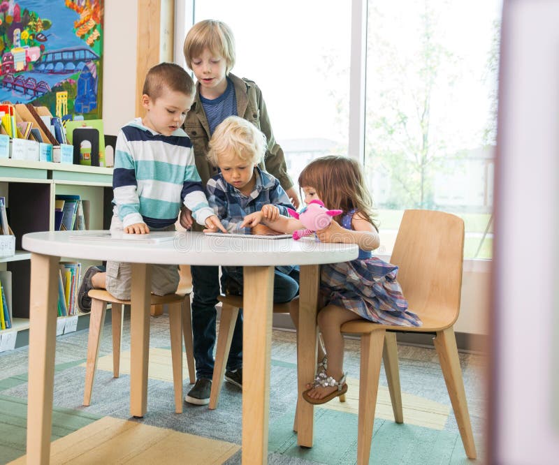 Children Using Digital Tablet with Teacher Stock Image - Image of ...