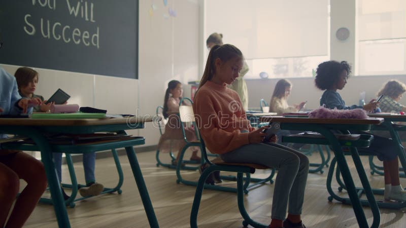 Children Using Digital Tablets at Lesson. Girl Holding Tablet Computer ...