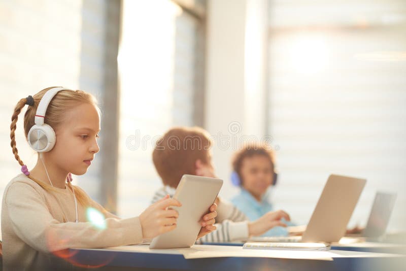 Children Using Gadgets in Class Stock Photo - Image of boys, headphones ...