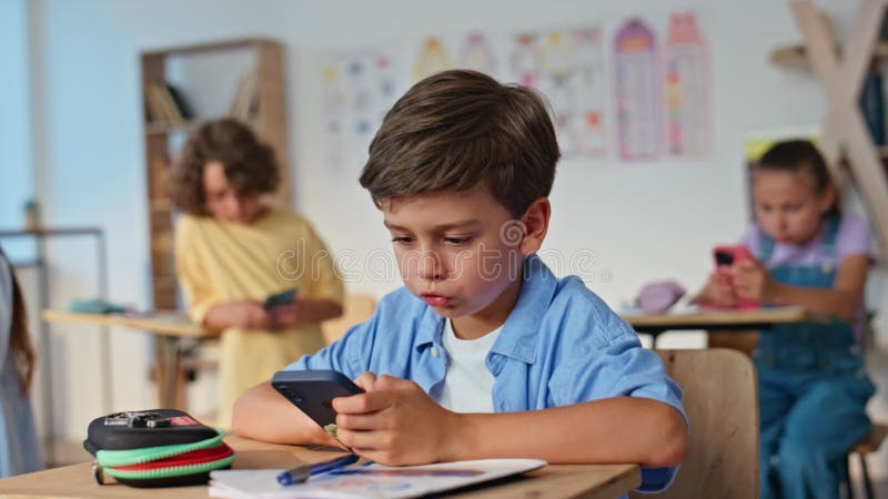 Children Using Gadgets Classroom at Group Activity. Students Elementary ...