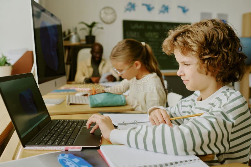 Children Using Laptop in Classroom Setting Stock Image - Image of ...