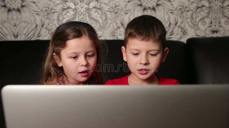 Over the Shoulder Little Boy Use Laptop with Green Screen Mock-up on a ...