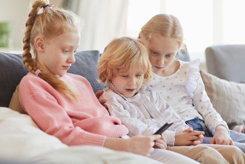 Children Using Phone at Home Stock Image - Image of boys, comfortable ...