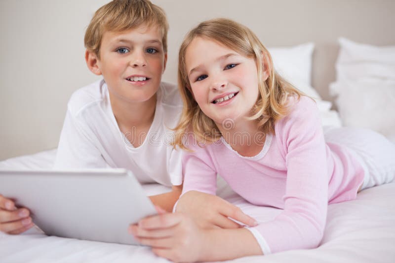 Children with tablet stock photo. Image of home, person - 37961462