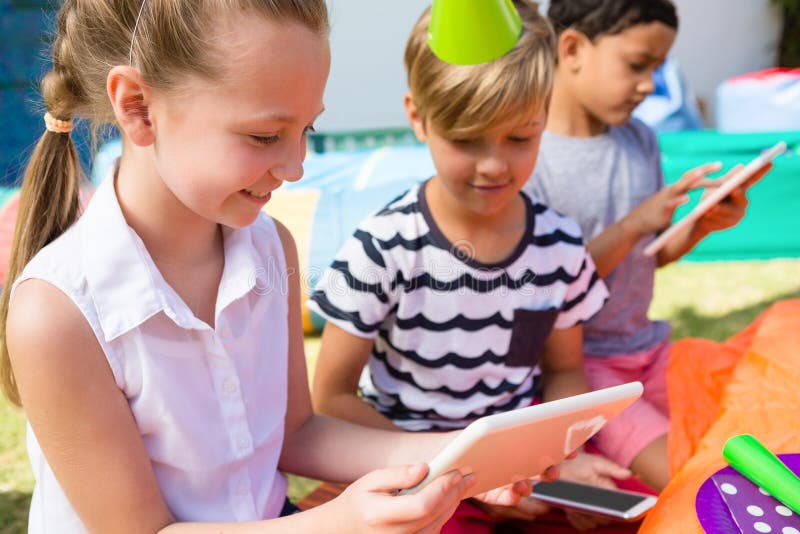 Children Using Tablet Computer during Birthday Party Stock Photo ...