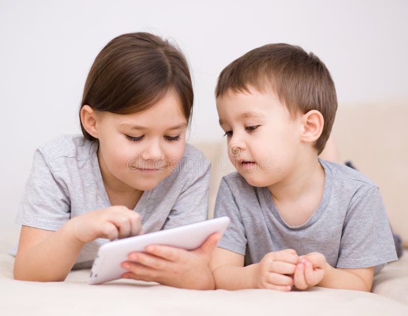 Children Using Tablet Computer Stock Image - Image of hand, brunette ...