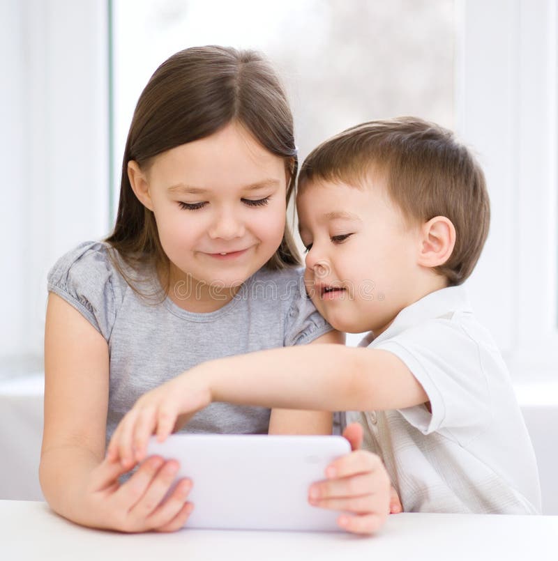 Children Using Tablet Computer Stock Photo - Image of pensive ...