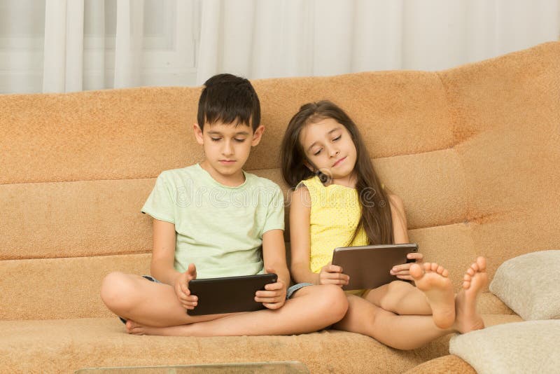 Children are Using Tablet while Sitting on the Stock Image - Image of ...