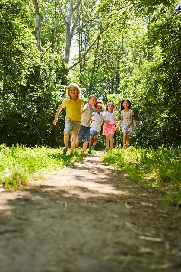 Children Walk Hand in Hand Over Meadow Stock Photo - Image of hand ...