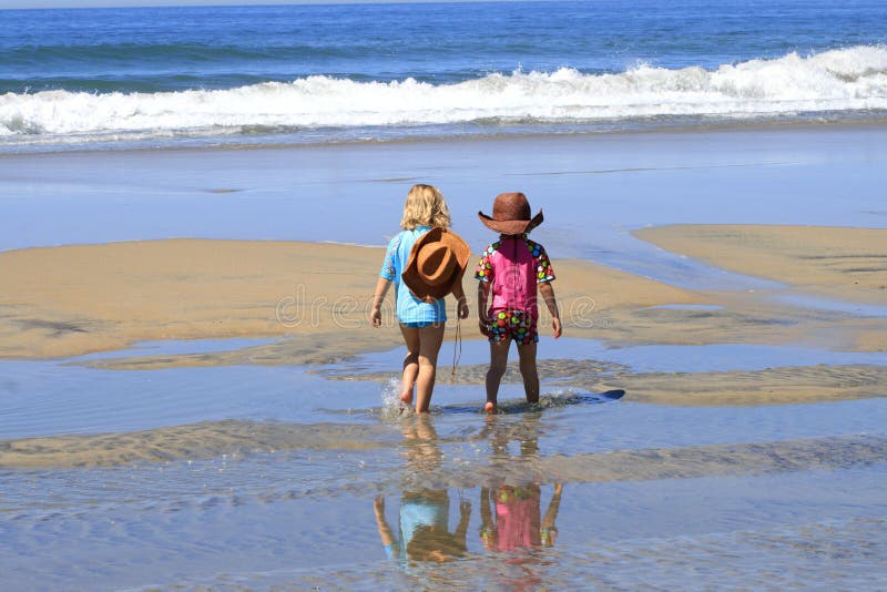 Children walking on beach stock image. Image of children - 8891651