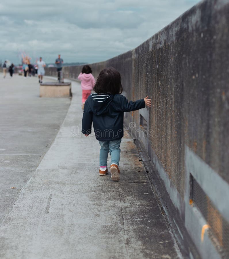 Children Walking Outside on a Cloudy Day Stock Photo - Image of park ...