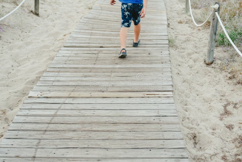 Children Walking on Wooden Path Towards the Beach in Summer Stock Image ...