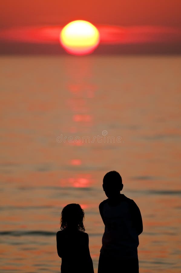 Children Watching the Sunset Stock Photo - Image of nature, skyline ...