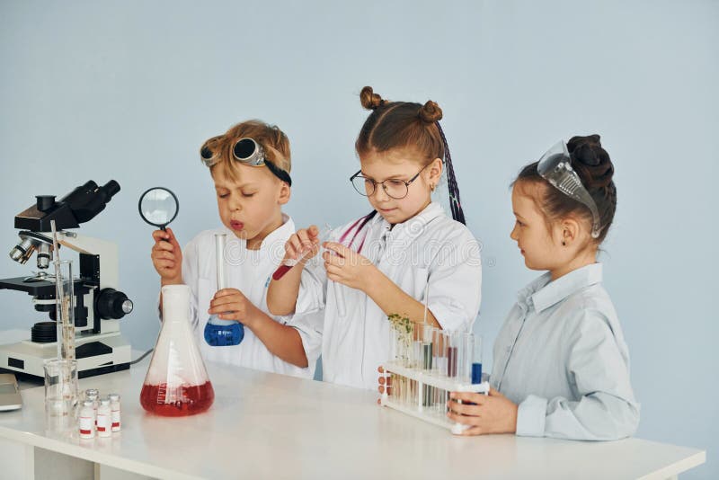 Children in White Coats Plays a Scientists in Lab by Using Equipment ...