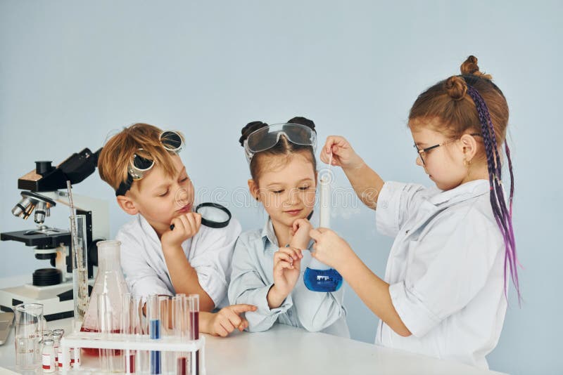 Children in White Coats Plays a Scientists in Lab by Using Equipment ...
