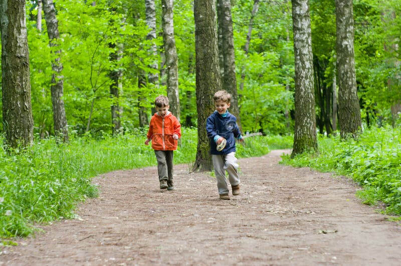 Children in the woods stock image. Image of running, orange - 56034817