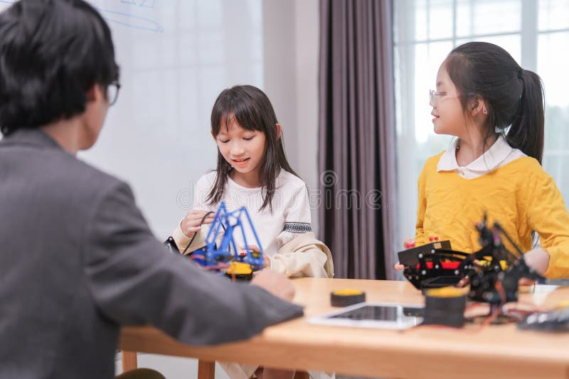 Children Working on Circuit Boards of Small Robot at Technology and ...
