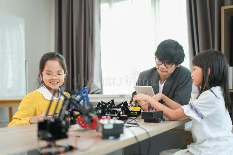 Children Working on Circuit Boards of Small Robot at Technology and ...