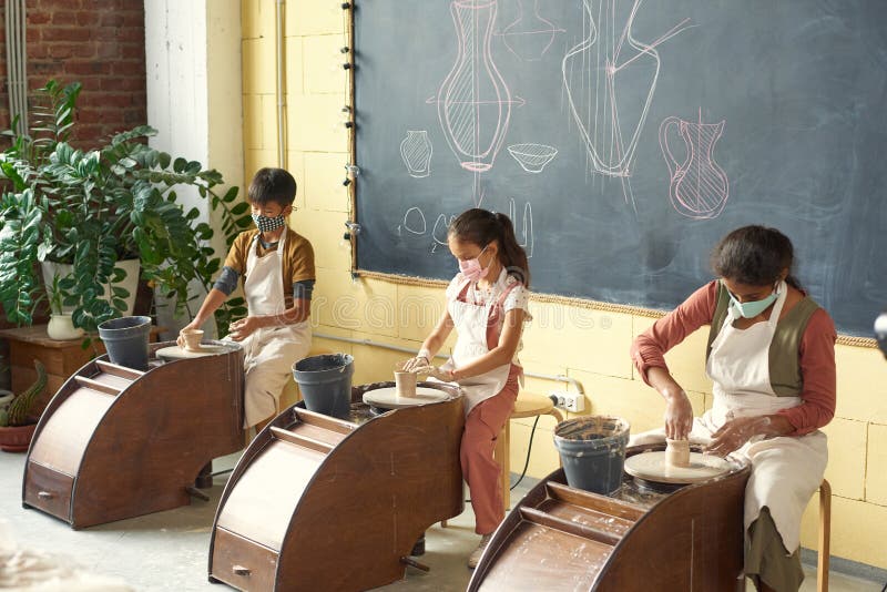 Children Working with Pottery Wheels Stock Image - Image of potter ...