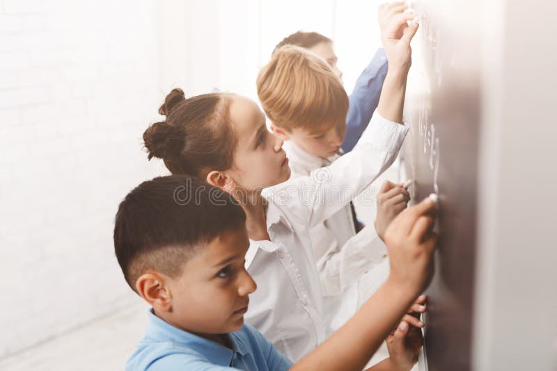Children Writing Maths Equations on the Board Stock Image - Image of ...