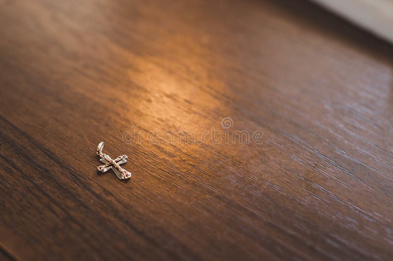 A Small Cross Lies on the Lacquered Table 1485. Stock Photo - Image of ...