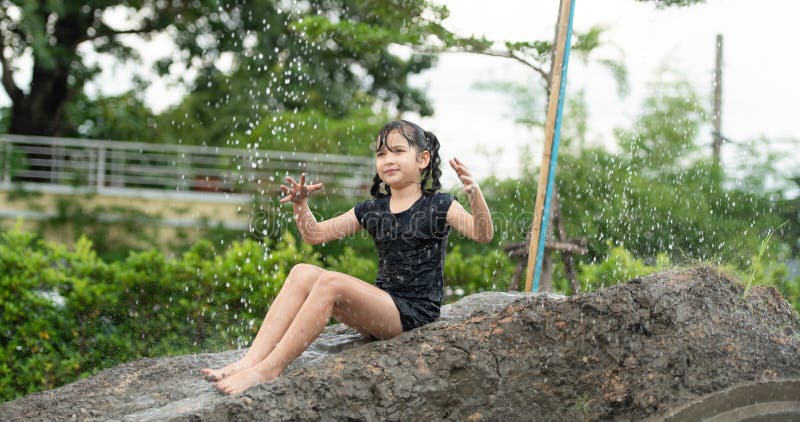 Childrens Have Fun Playing Mud Slides in the Community Fields Stock ...
