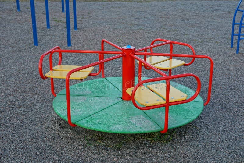 Childrens Playground with a Round Colored Carousel on the Ground in the ...