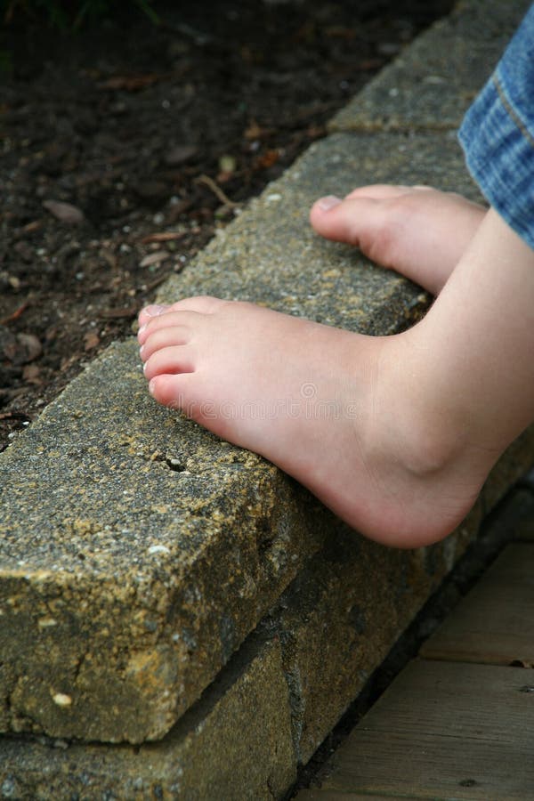 Childs feet stock image. Image of summer, wait, brick, rest - 993763