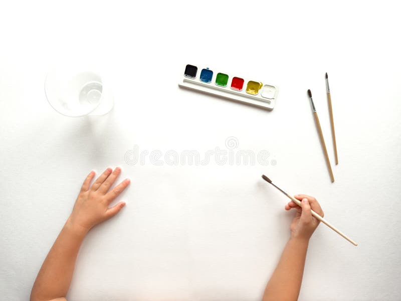 Childs Hands Begin Creative Art Project with Paints and Brushes Stock ...