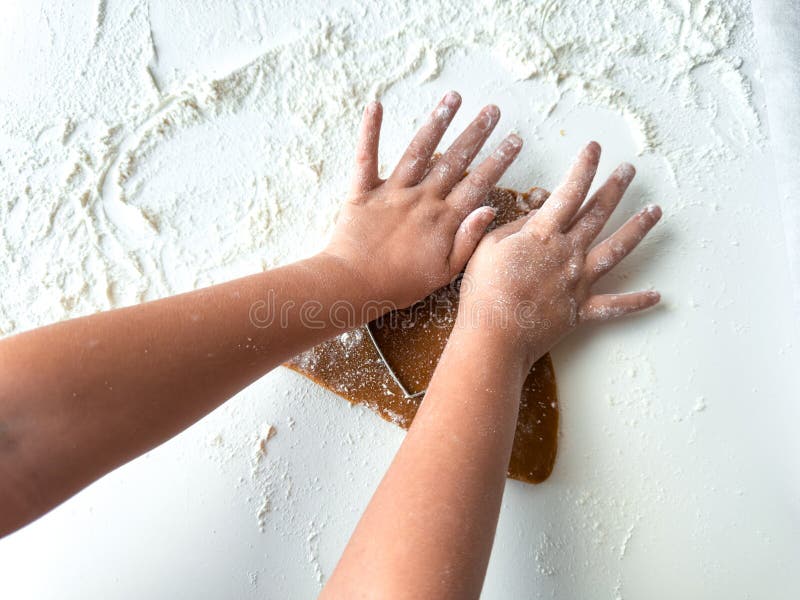 Childs Hands Kneading Dough on Flour Covered Surface Stock Photo ...