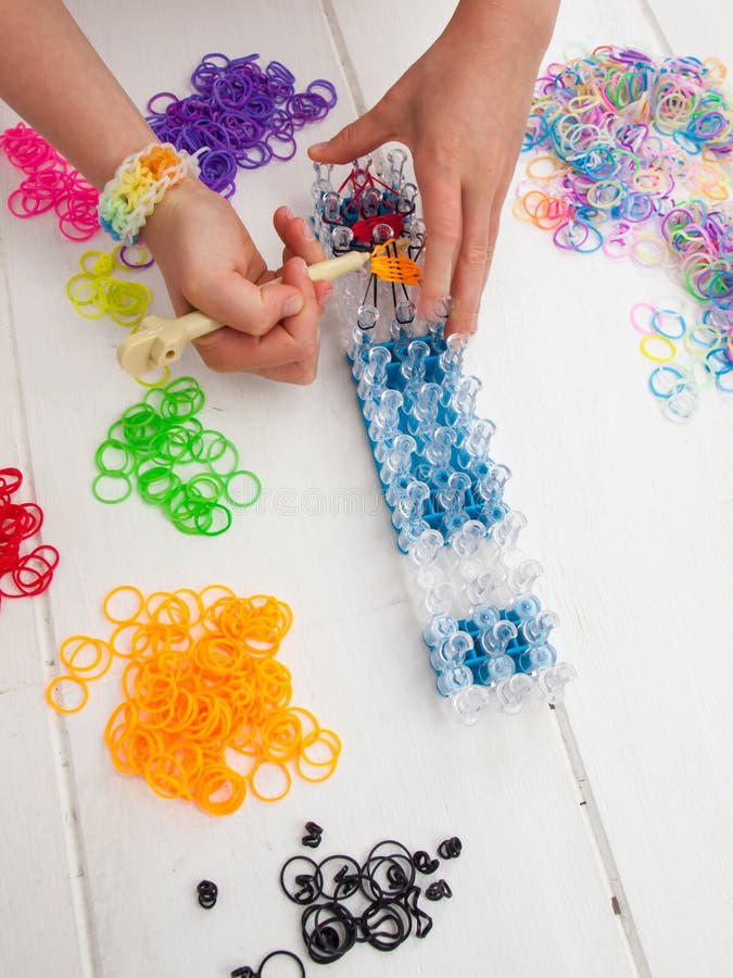 Childs Hands Making a Bracelet on a Band Loom Stock Image - Image of ...