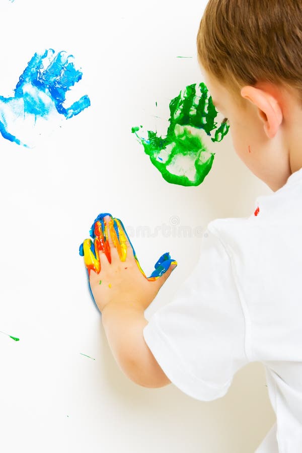 Childs Messy Painted Hands on the Wall Stock Image - Image of play ...