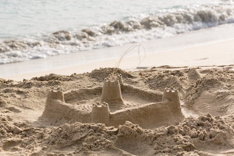 Childs Sand Castle on Beach by Ocean Stock Photo - Image of ...